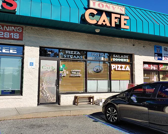 Tony's Cafe's unassuming storefront is like that friend who doesn't brag but always delivers. The teal-topped sign has guided hungry Newark locals to pizza paradise for generations.