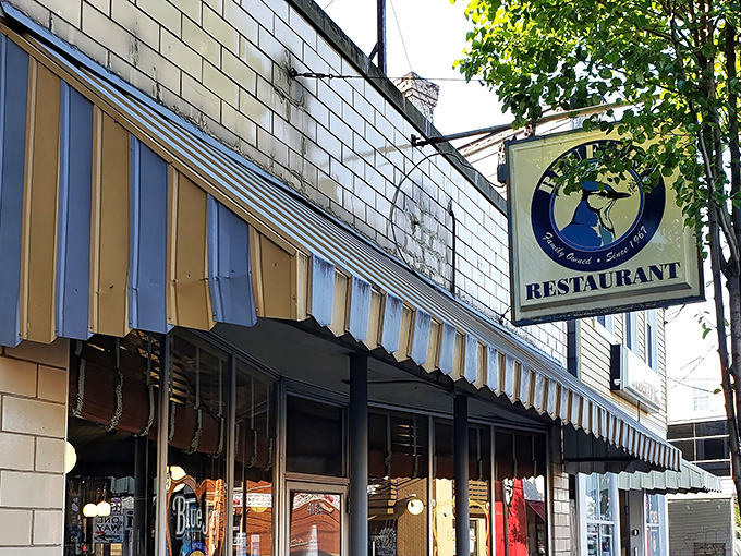 The Blue Jay's iconic striped awning and golden "50 years" balloons aren't just decoration—they're a promise of Cincinnati breakfast history that's stood the test of time.