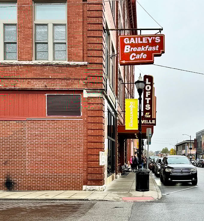 The iconic orange Gailey's sign beckons breakfast enthusiasts like a beacon of hope on Springfield's historic brick landscape. Morning salvation awaits inside!
