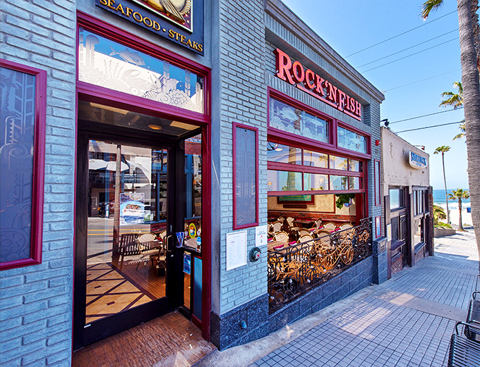 The iconic blue exterior with bold red trim makes Rock'N Fish impossible to miss, like a maritime flag signaling "delicious food ahead" to hungry Manhattan Beach explorers.