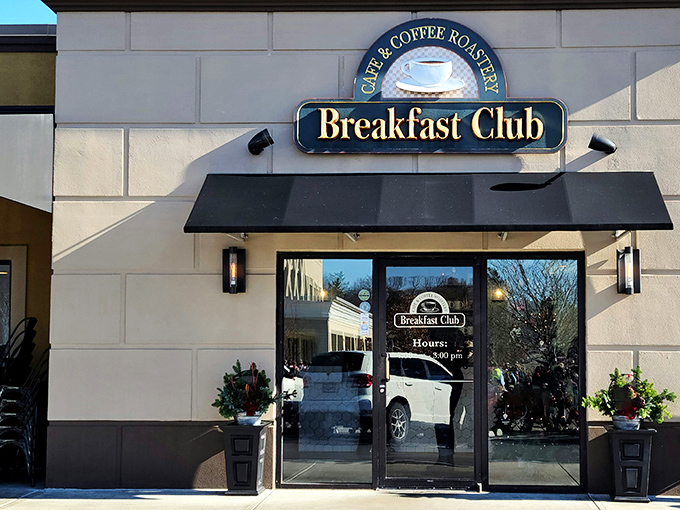 The Breakfast Club's welcoming façade stands like a beacon for morning food pilgrims, with its classic black awning promising comfort inside.