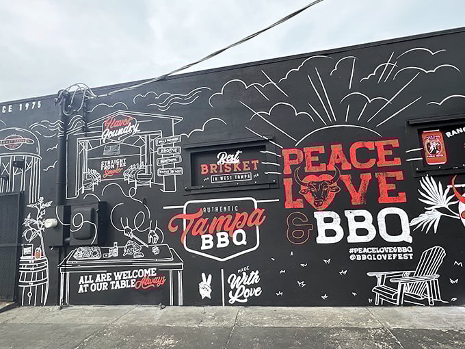 The black exterior with white chalk-style art isn't just Instagram bait—it's a barbecue bat signal calling hungry Floridians to smoky paradise.
