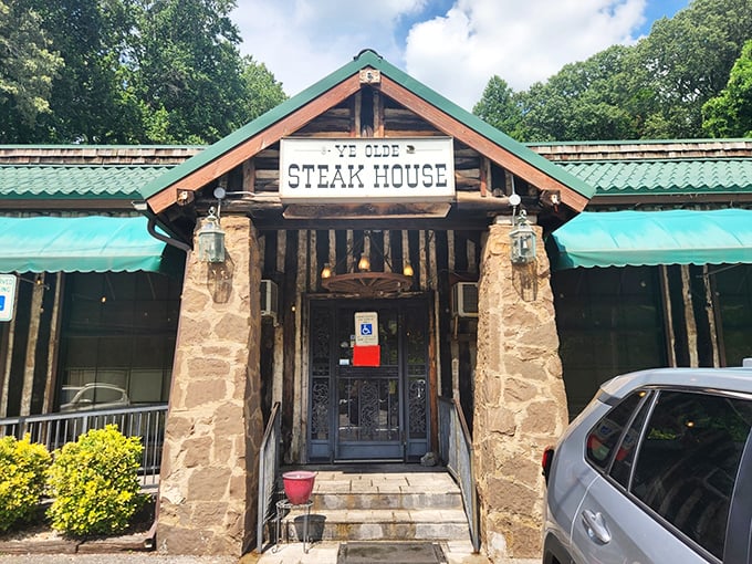 The stone pillars and rustic wooden facade aren't just for show—they're the gateway to one of Knoxville's most beloved culinary time machines.