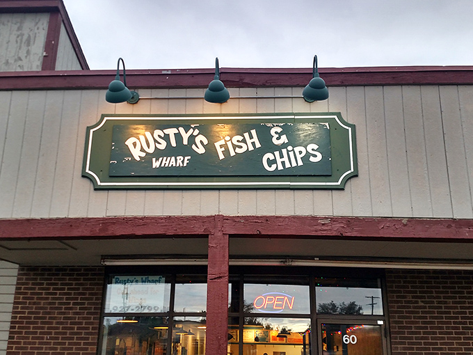 The unassuming storefront of Rusty's Wharf beckons with its no-frills charm and glowing "OPEN" sign—proof that seafood treasures often hide in plain sight.