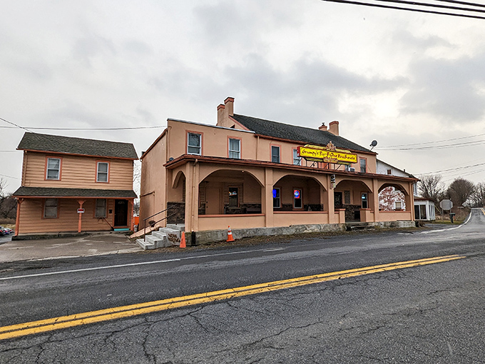 The salmon-colored exterior of Grumpy's welcomes hungry travelers like a barbecue beacon on the Pennsylvania landscape, complete with charming arched porch.