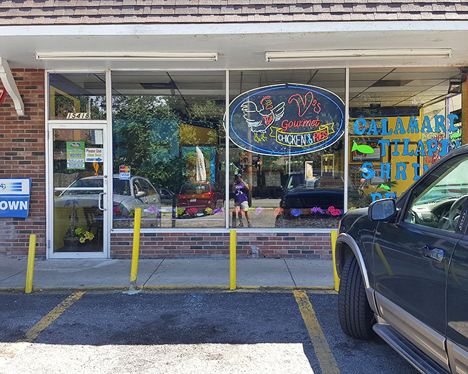 The unassuming storefront of V's Gourmet Chicken might not stop traffic, but trust me—your taste buds will slam on the brakes once you're inside.