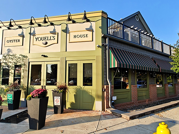 The sage-green façade of Youell's Oyster House welcomes seafood lovers with its elegant signage and vibrant flower boxes—a maritime oasis in downtown Allentown.