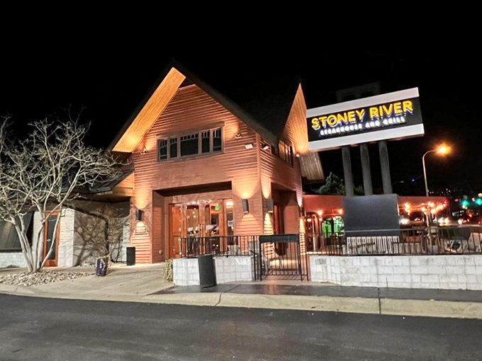 The A-frame exterior of Stoney River glows like a beacon for hungry travelers, promising mountain lodge comfort with Nashville sophistication.