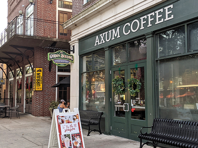 The historic brick façade of Axum Coffee stands like a beacon of caffeinated hope on Winter Garden's charming Plant Street.