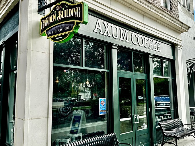 The historic brick façade of Axum Coffee stands like a beacon of caffeinated hope on Winter Garden's charming Plant Street.