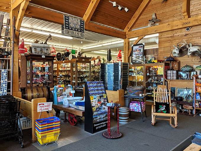 The warm wooden interior of Hog Creek Antique Mall beckons treasure hunters with its labyrinth of vendor booths—a paradise where history whispers from every shelf.