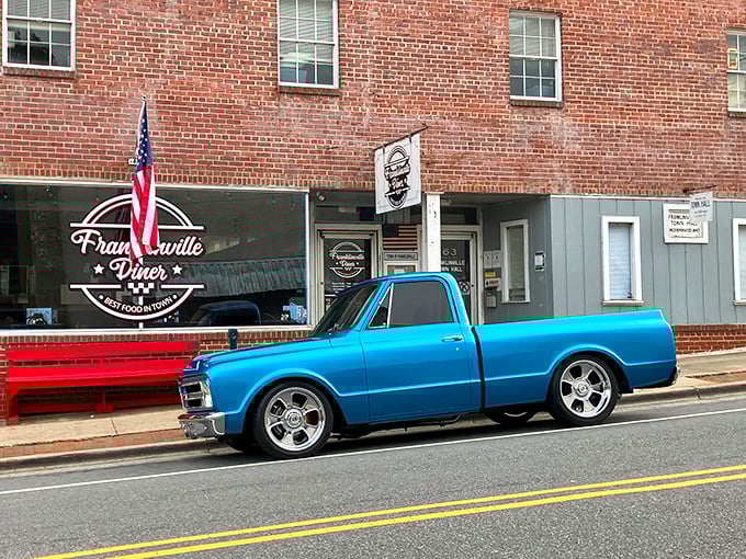 Classic Americana at its finest – a vintage blue pickup parked outside the brick-fronted Franklinville Diner, where time slows down and appetites ramp up.