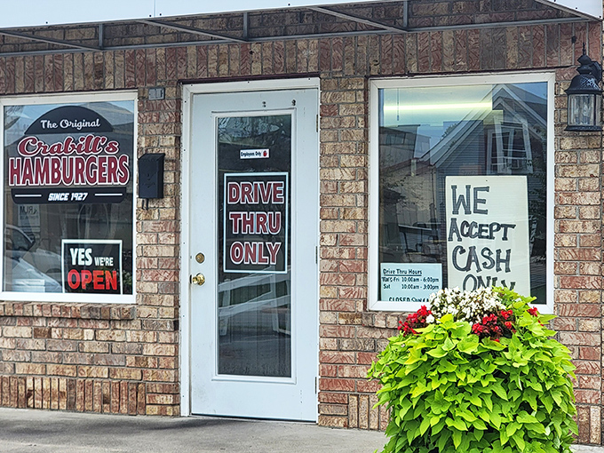 The unassuming brick exterior of Crabill's Hamburger Shoppe proves that culinary greatness often comes in small packages. This tiny burger temple has been an Urbana institution for generations.