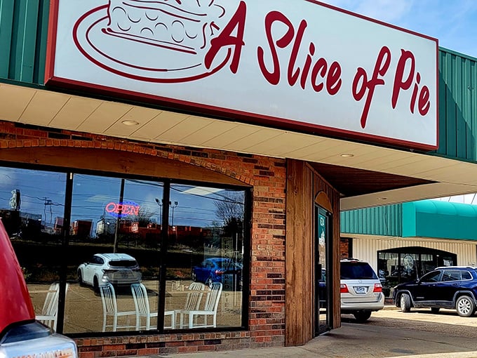 The green exterior and bold red signage stand as a humble beacon of hope for weary travelers. This unassuming storefront holds treasures that would make Marie Antoinette rethink her cake recommendation.