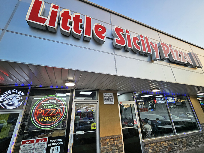 The bright red sign of Little Sicily Pizza 2 beckons like a lighthouse for the hungry. Philadelphia's culinary odd couple – Italian tradition meets Indian spice – hiding in plain sight.