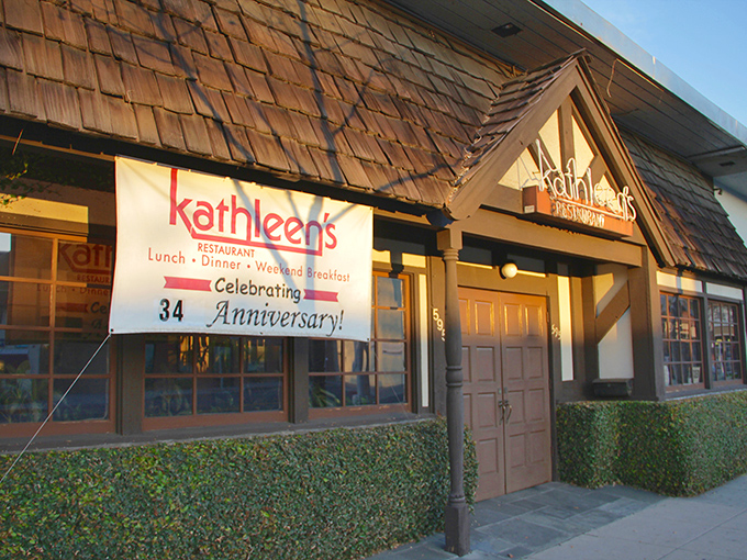 The charming cottage-like exterior of Kathleen's Restaurant beckons with its stone foundation and distinctive shingled roof—a breakfast sanctuary hiding in plain sight.