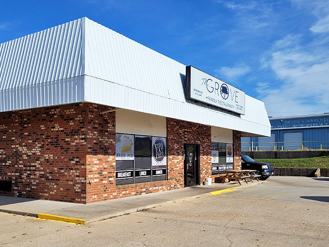 The unassuming brick facade of The Grove Family Restaurant hides culinary treasures within. That "FREE PIE" sign isn't just decoration—it's a promise of sweet things to come.