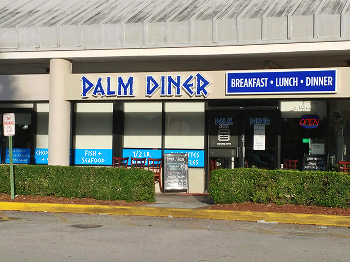 The iconic blue lettering of Palm Diner stands out like a beacon for hungry travelers. This Boynton Beach institution promises three square meals and seafood that's worth the trip.