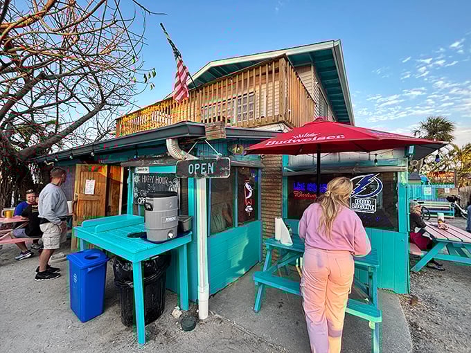 The turquoise beacon of burger paradise stands proudly on Holmes Beach, where the American flag waves as if to say, "Yes, this is what freedom tastes like."