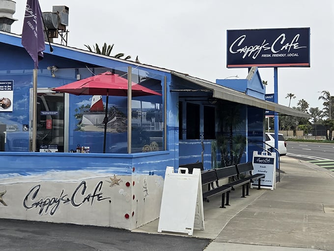 The iconic blue exterior of Cappy's Café stands out like a beacon of breakfast hope on Newport Beach's coastline.
