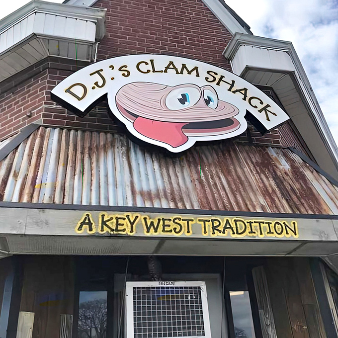 The white picket fence isn't keeping anyone out—it's practically herding seafood lovers into this Key West treasure on bustling Duval Street.