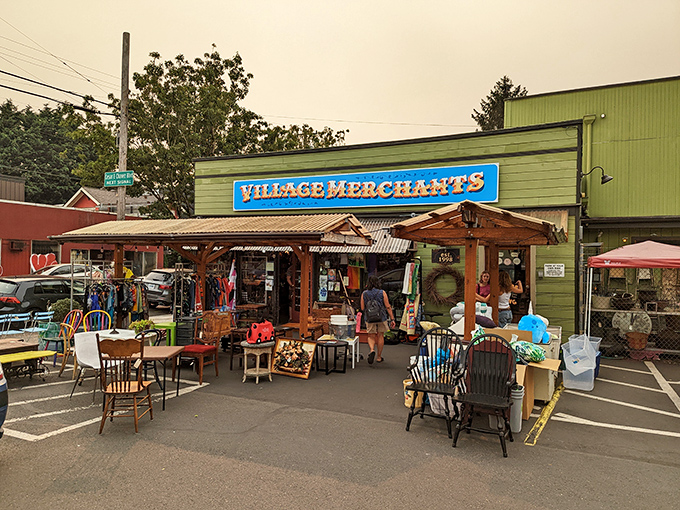 The iconic blue sign of Village Merchants beckons treasure hunters to this Portland paradise where outdoor displays offer a tantalizing preview of the wonders within.