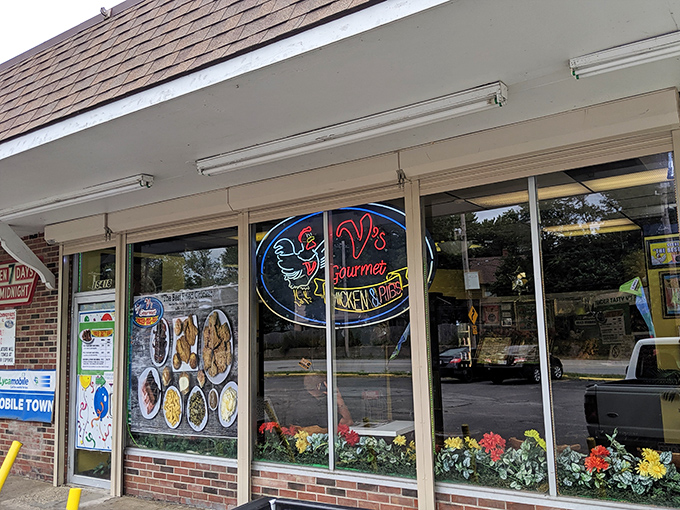 The unassuming storefront of V's Gourmet Chicken might not win architectural awards, but those yellow bollards are guarding culinary treasure that locals have cherished for years.