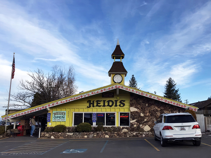 The bright yellow Alpine chalet with its charming clock tower isn't just eye-catching—it's a promise that breakfast dreams come true inside.