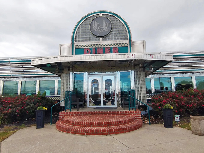 The classic curved facade with its bold "DINER" signage isn't just an entrance—it's a time machine to when comfort food reigned supreme.
