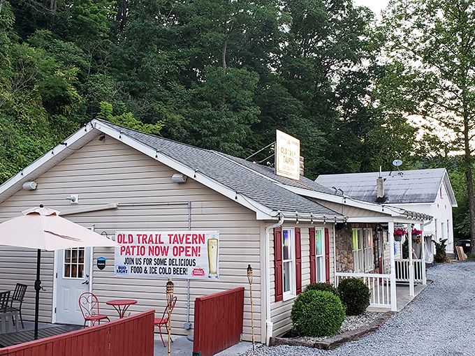 The unassuming exterior of Old Trail Tavern + Steak stands like a culinary lighthouse against the Pennsylvania hills, promising comfort and satisfaction to weary travelers.