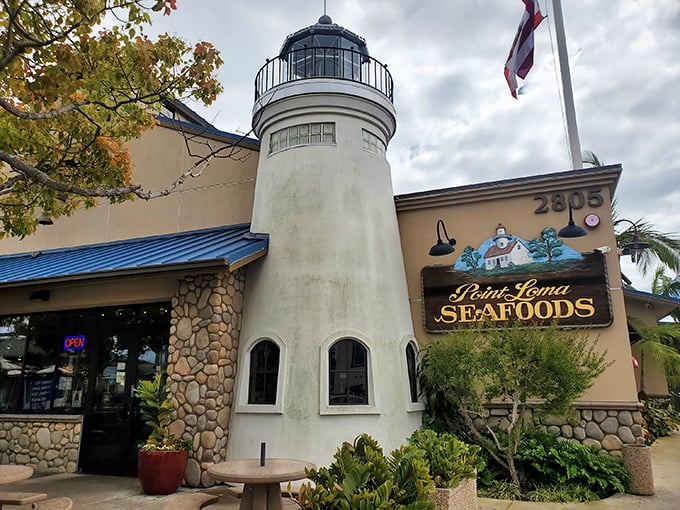The lighthouse-shaped entrance isn't just architectural whimsy—it's a beacon calling seafood lovers home to Point Loma Seafoods in San Diego.