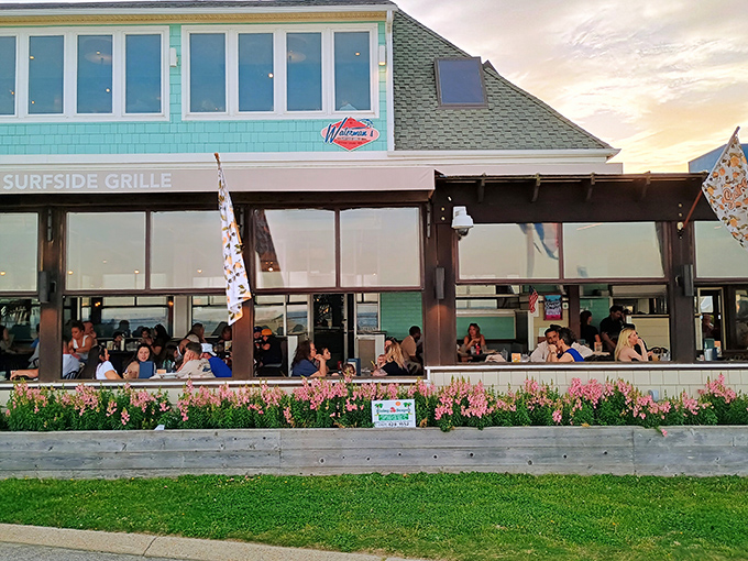 The aqua-colored exterior of Waterman's stands like a coastal beacon, promising seafood treasures within its unassuming beach house façade.