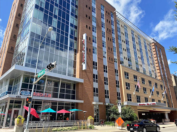 The corner spot that launched a thousand brunch pilgrimages. Bassett Street Brunch Club's modern exterior promises culinary salvation for the morning-starved masses.