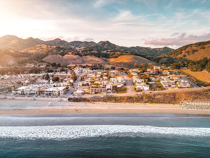 Avila Beach unfolds like a Mediterranean daydream, where golden hills embrace a perfect crescent of sand and sea. California coastal living at its most picturesque.
