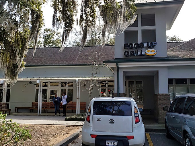 The inviting exterior of Eggs Up Grill beckons with its cheerful sign and welcoming porch – like a breakfast lighthouse guiding hungry souls to shore.