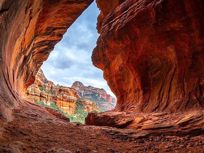 Nature's cathedral awaits at every turn in Red Rock State Park, where the sky peeks through ancient stone windows carved by time itself.