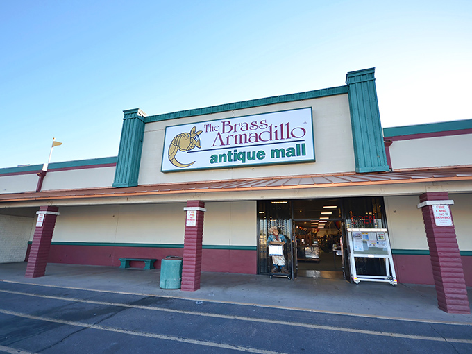 The teal-trimmed facade of Brass Armadillo beckons treasure hunters with its distinctive armadillo logo—a portal to yesterday waiting to be explored.