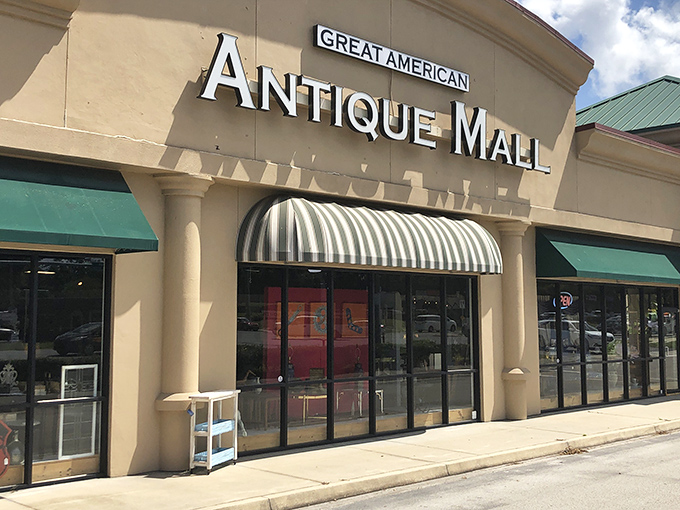 The storefront beckons with its classic striped awning – like a time portal disguised as a strip mall tenant. Treasure awaits!