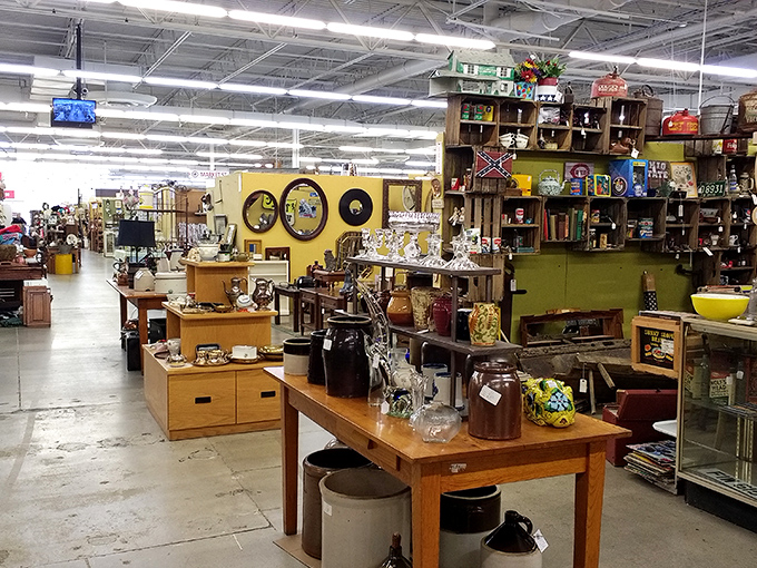 Treasure hunters navigate the well-organized aisles of Antiques Village, where each booth feels like stepping into someone else's carefully curated memories.