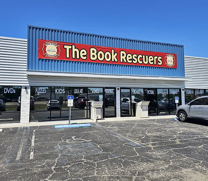 The blue storefront with its bold red banner announces its mission like a literary superhero's headquarters. Books, not capes, save the day here.