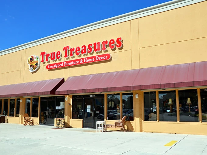 The storefront beckons with its bold red signage and burgundy awnings—like a treasure chest waiting to be opened in the Florida sunshine.