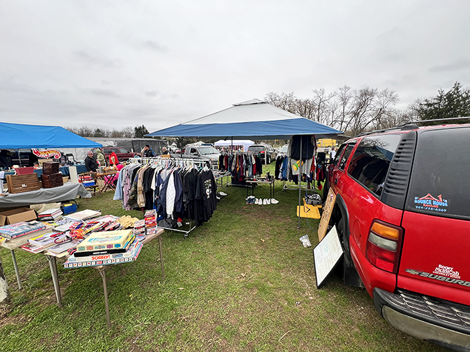Treasure hunting begins here! Blue canopies shelter endless possibilities while vendors arrange their wares, each table a miniature museum of potential discoveries.