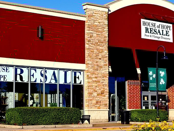 The distinctive red exterior of House of Hope Resale stands out like a beacon for bargain hunters, promising treasures that Walmart could only dream of housing.