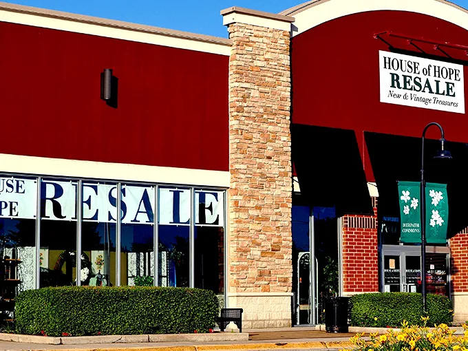 The distinctive red exterior of House of Hope Resale stands out like a beacon for bargain hunters, promising treasures that Walmart could only dream of housing.