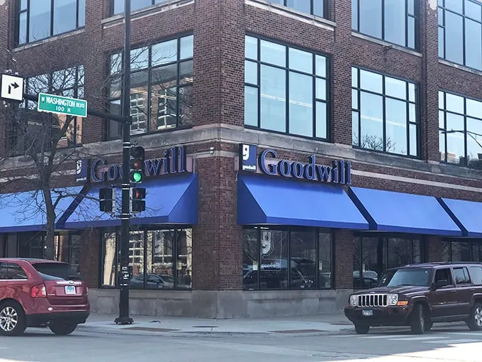 The iconic blue awning of Chicago's Goodwill beckons like a portal to possibility—where one person's castoffs become another's treasures.