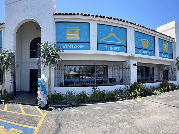 The Spanish-style exterior with its vibrant blue window panels promises treasures inside – like a stylish friend who always delivers on their promises.