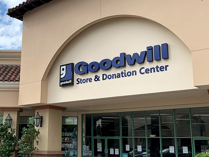 The Spanish-style façade of Ventura's Goodwill welcomes treasure hunters with palm-fringed promise and that iconic blue smile logo.