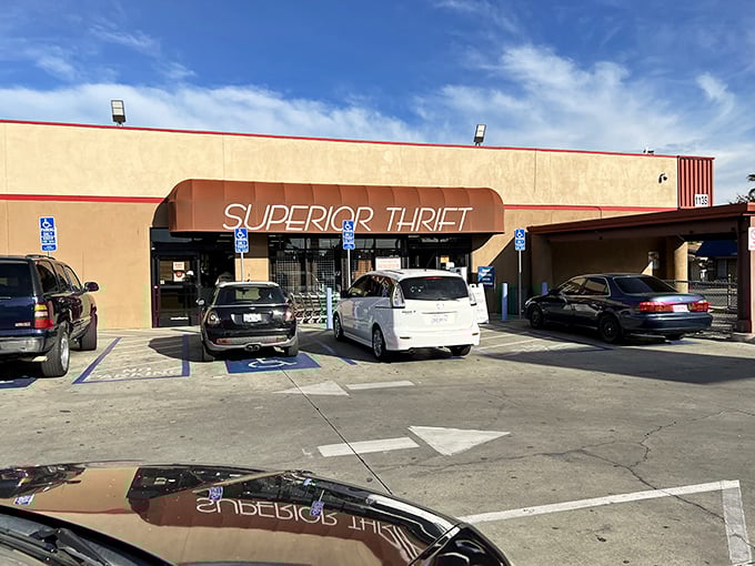 The unassuming exterior of Superior Thrift beckons with its orange awning and "New & Used" promise—a treasure cave disguised as a strip mall storefront.
