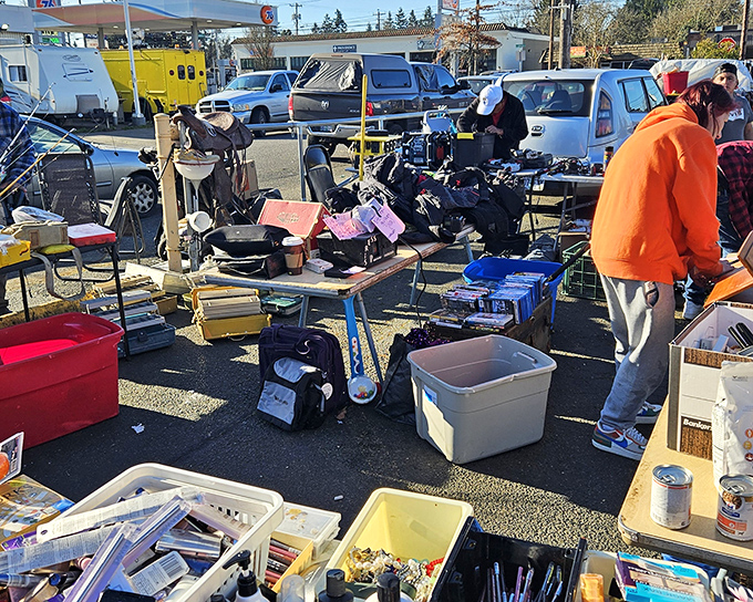 Shoppers navigate this asphalt bazaar with bags of possibility clutched in hopeful hands.