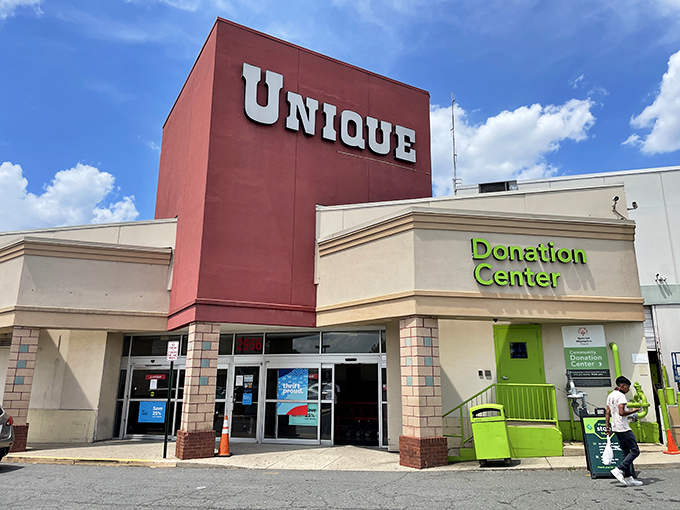 The iconic red tower of Unique Thrift Store stands like a beacon for bargain hunters, promising treasures within its massive walls.